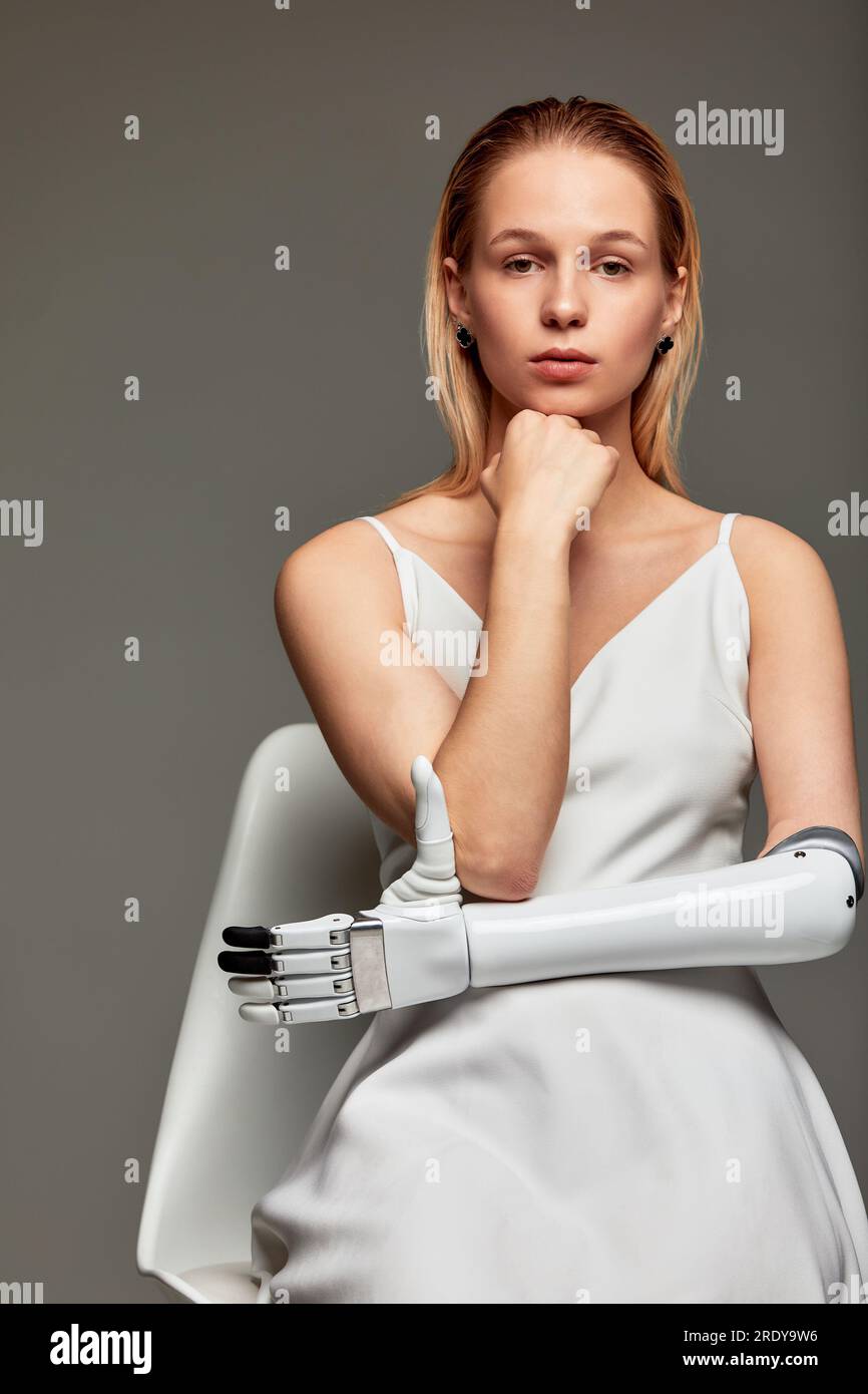 Studio portrait of young girl with disability wearing sensory bionic ...