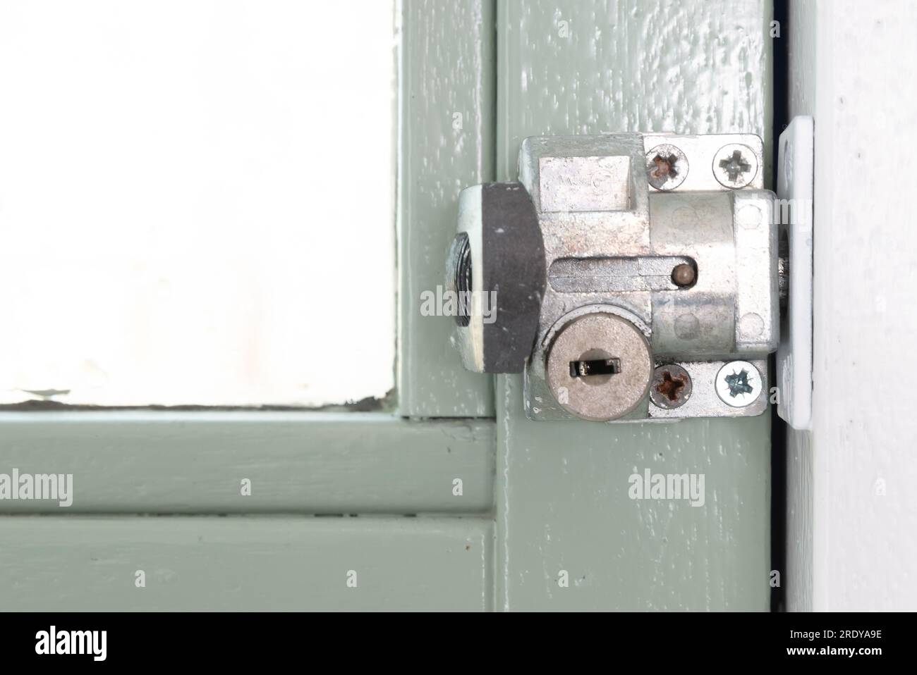 Simple lock on the inside of a window, selective focus Stock Photo - Alamy