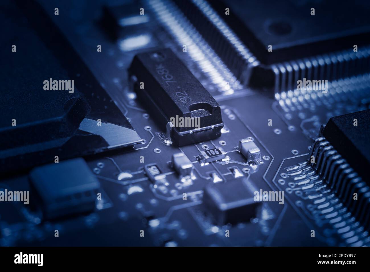 Closeup of Printed Circuit Board with processor, integrated circuits and many other surface ...