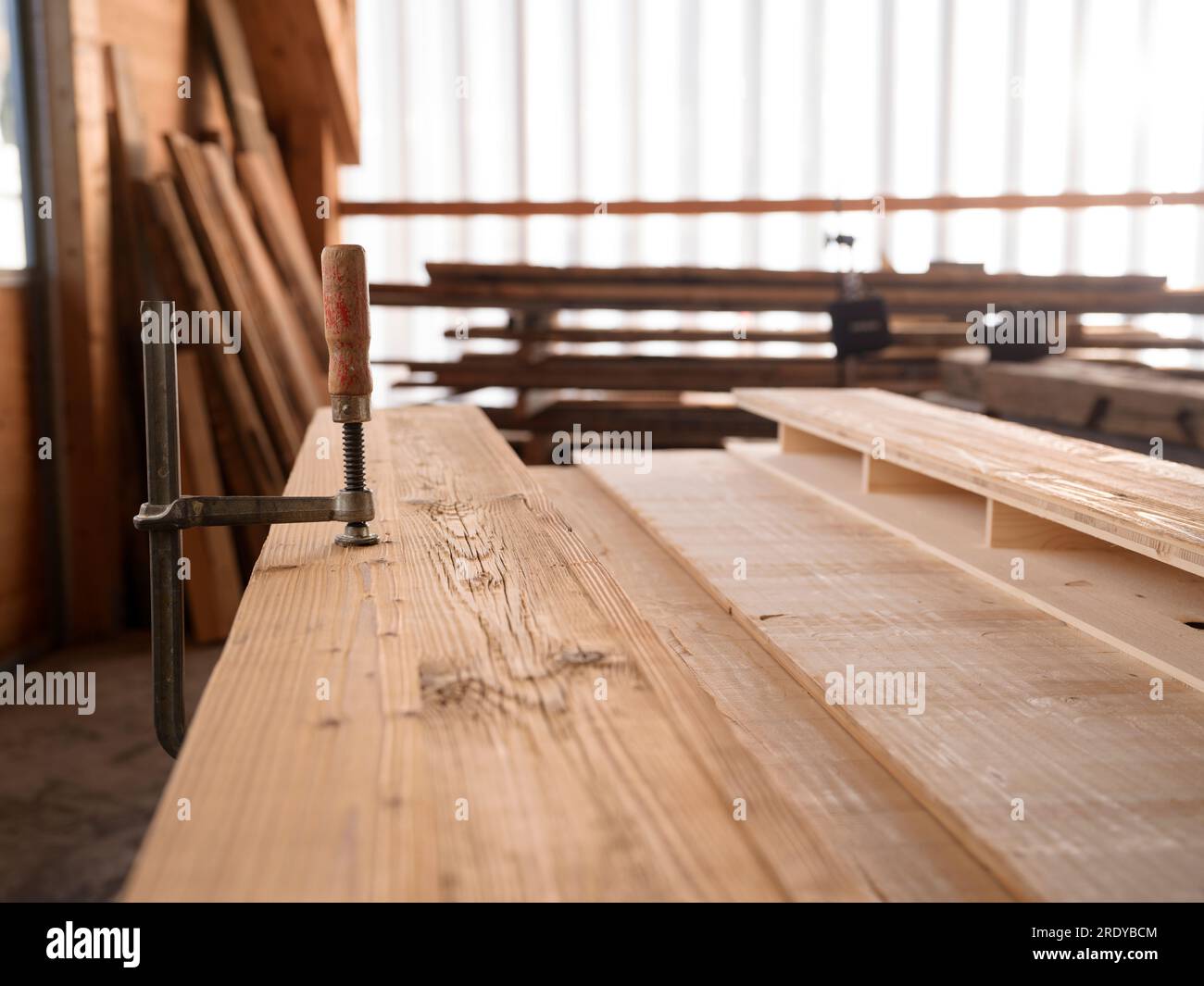 Timber plank at carpentry workshop Stock Photo - Alamy