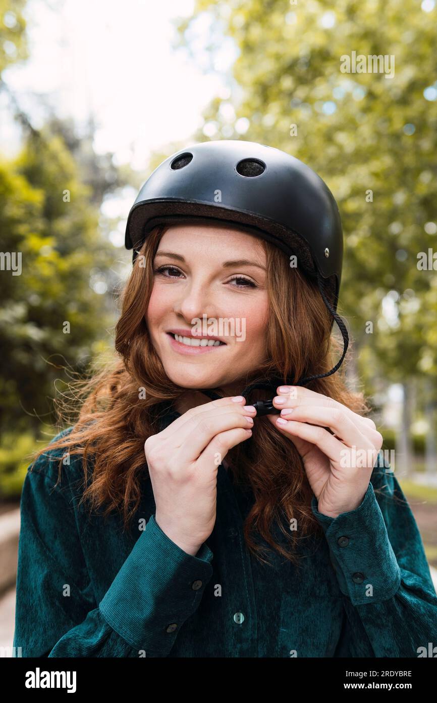 Adjusting helmet hi-res stock photography and images - Alamy