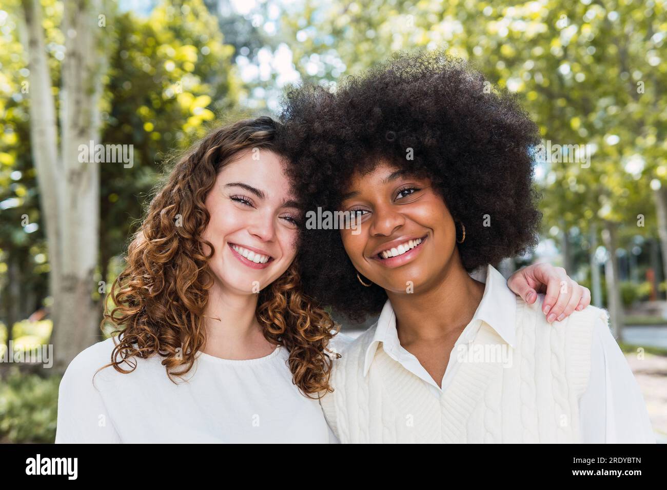 Two happy multicultural friends hi-res stock photography and images - Alamy