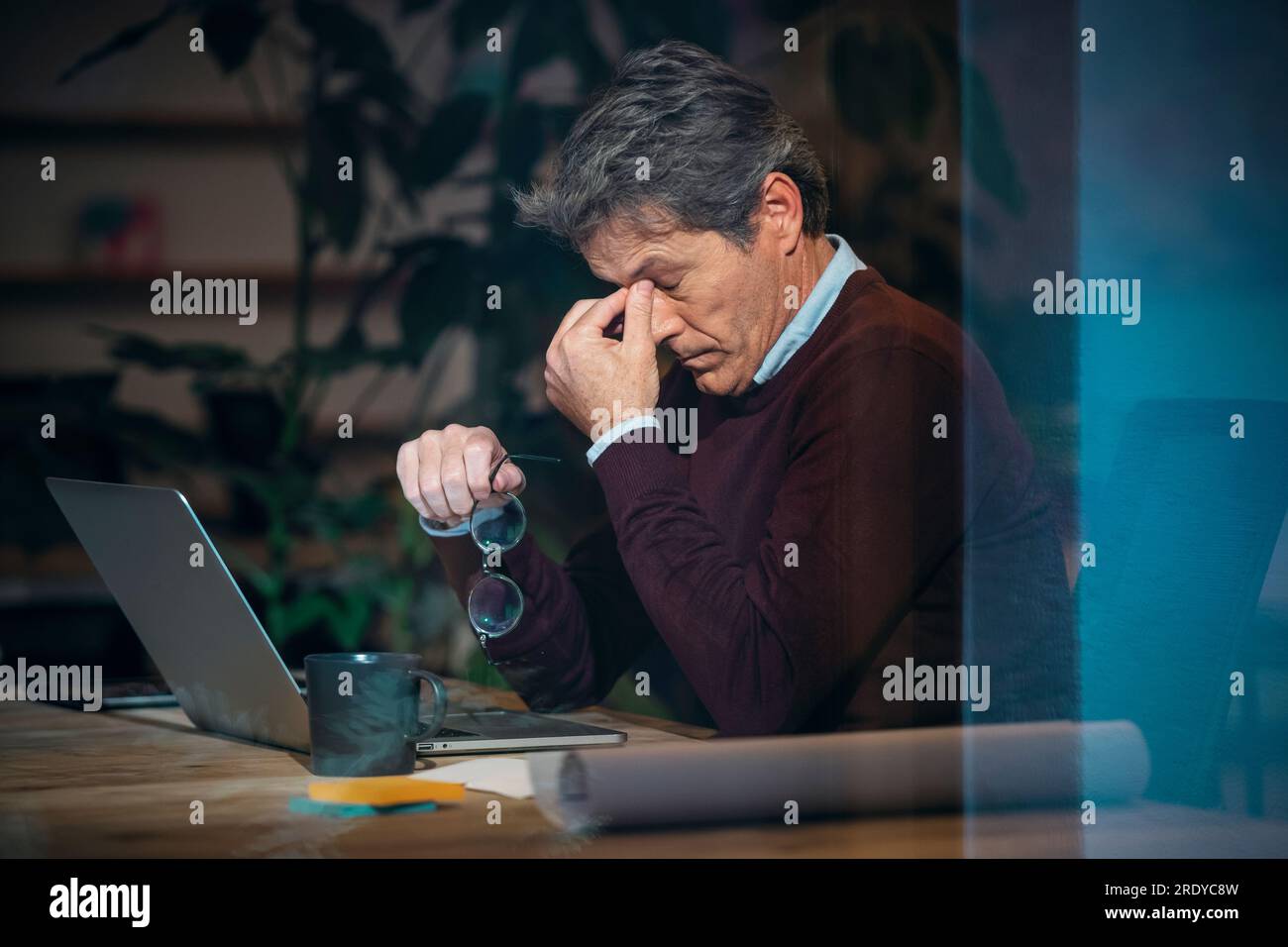 Architect taking break after using laptop in office Stock Photo - Alamy