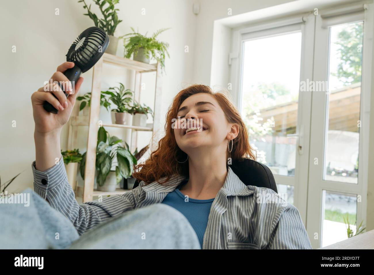 Beautiful woman with fan hi-res stock photography and images - Alamy