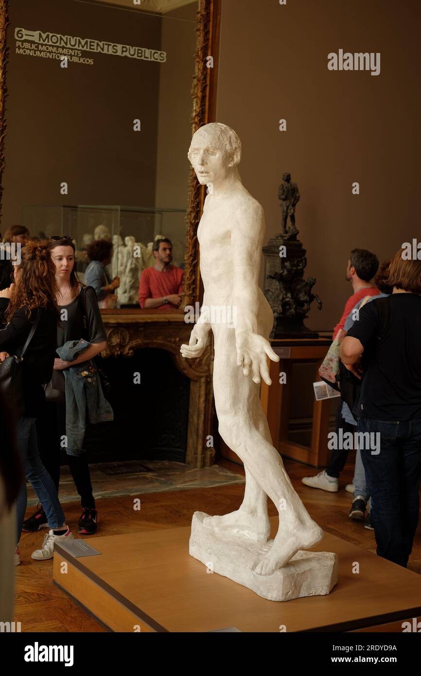 Jean de Fiennes (1885-86) by Rodin being viewed by people in the ornate ...