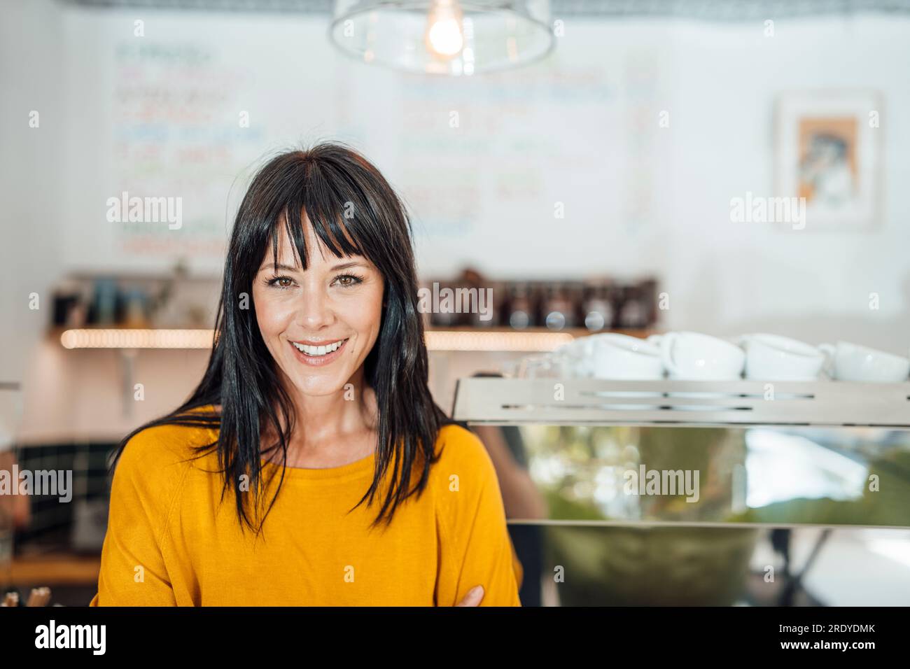 Mature female owner smiling hi-res stock photography and images - Alamy