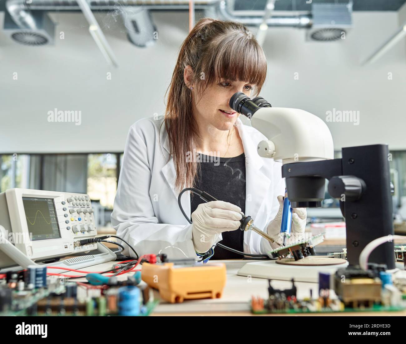 Scientist soldering circuit board in laboratory Stock Photo - Alamy