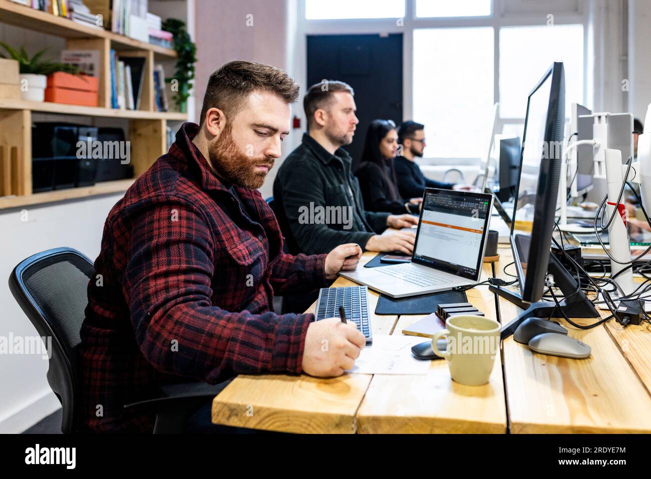 Working with colleagues hi-res stock photography and images - Alamy