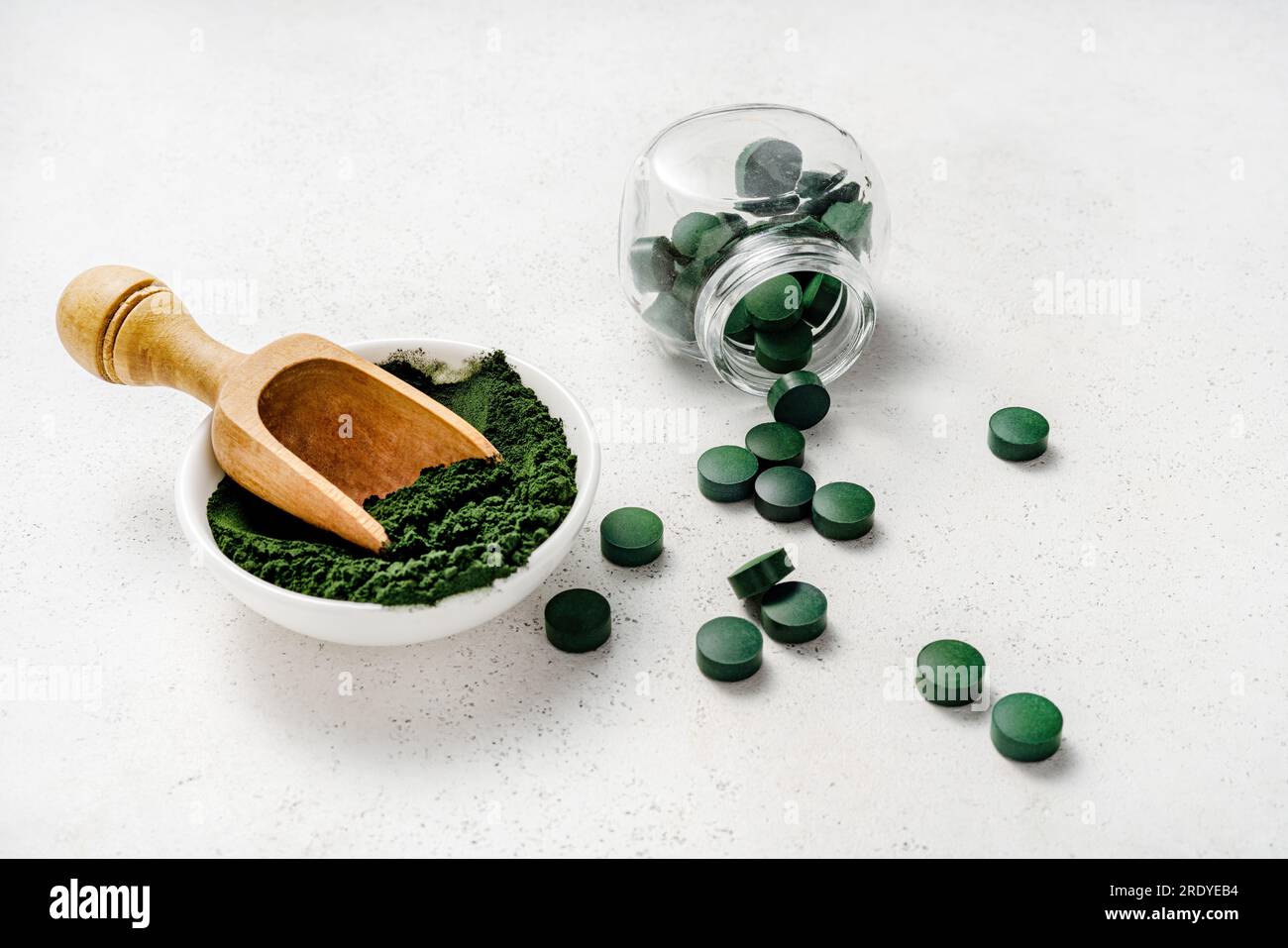 Spirulina algae powder and Spirulina tablets on white background Stock ...