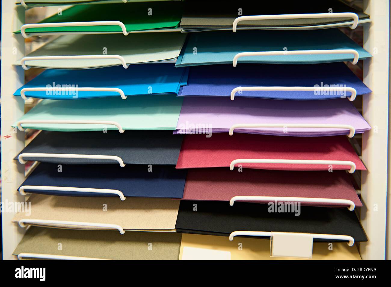 Close-up shelf with multi colored cardboard sheets and paper for pastel ...