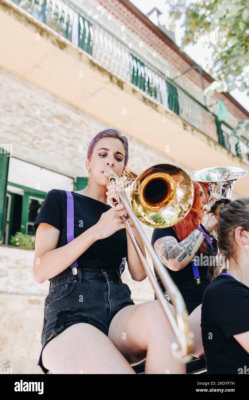 Woman playing trombone hi-res stock photography and images - Alamy