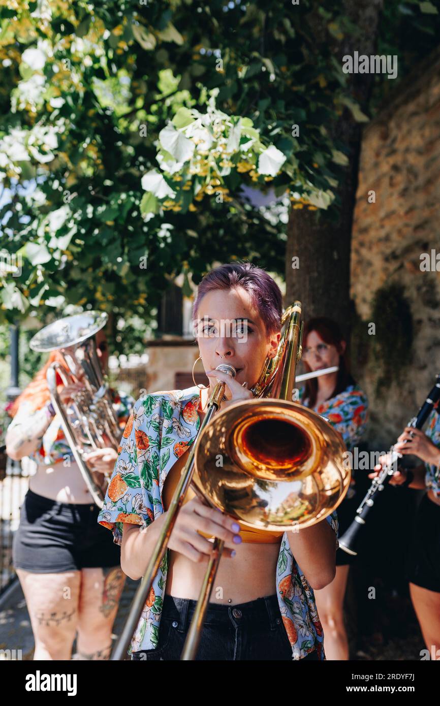 Musician playing trumpet with group Stock Photo - Alamy