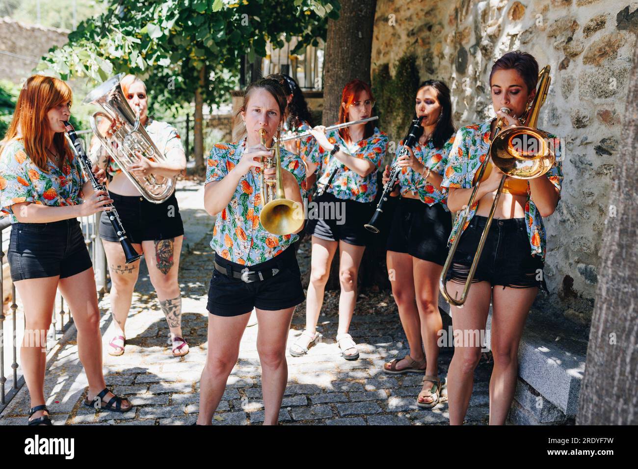 Artists practicing musical instruments standing on footpath Stock Photo ...