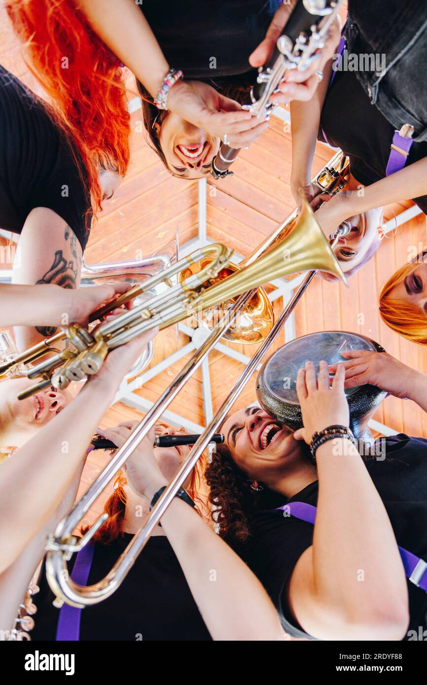 Happy women folk group enjoying with musical instruments Stock Photo ...
