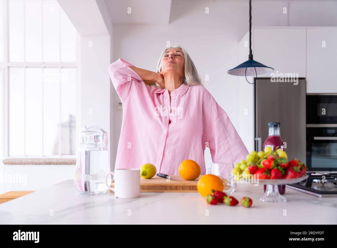 Caucasian woman stretching neck hi-res stock photography and images - Alamy