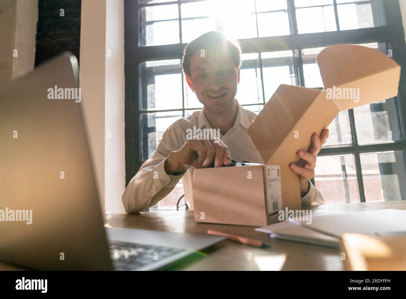 Businessman packing up desk hi-res stock photography and images - Alamy
