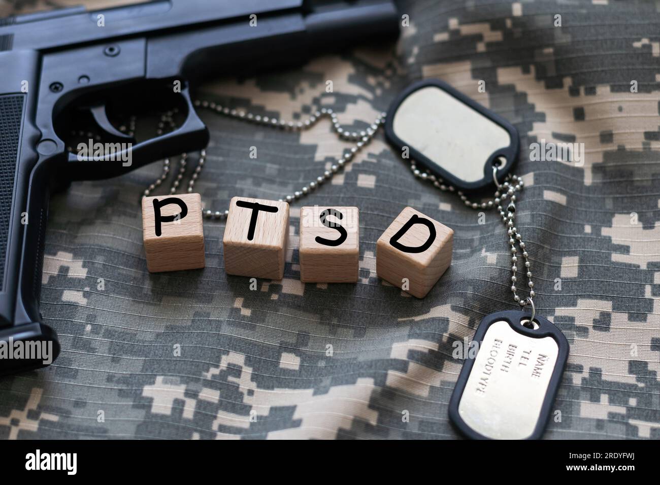 the word PTSD laid with silver metal letters on flat rusted steel sheet ...