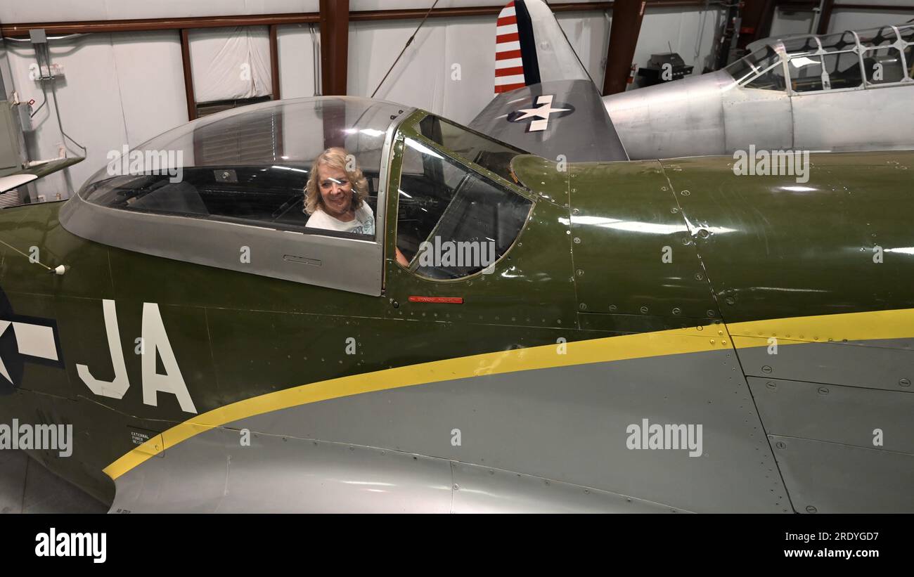 A Lady sitting in the cockpit of a P-51 Mustang. The North American ...