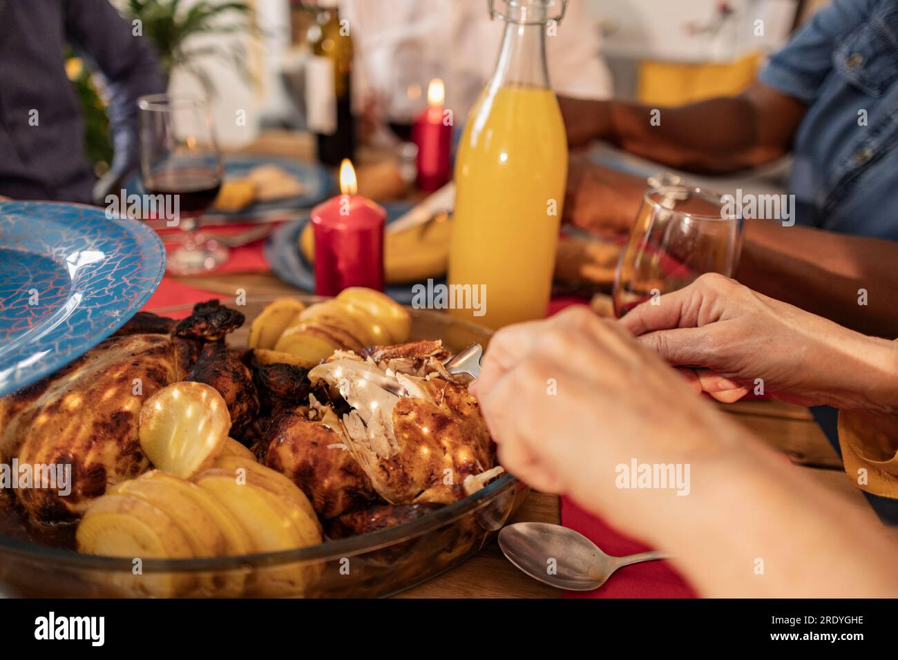 Hands of woman eating meat at dining table Stock Photo - Alamy