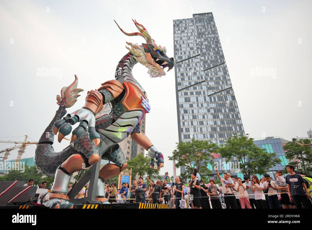 A 10-meter-high mech dragon performs at the Joy City shopping mall in ...