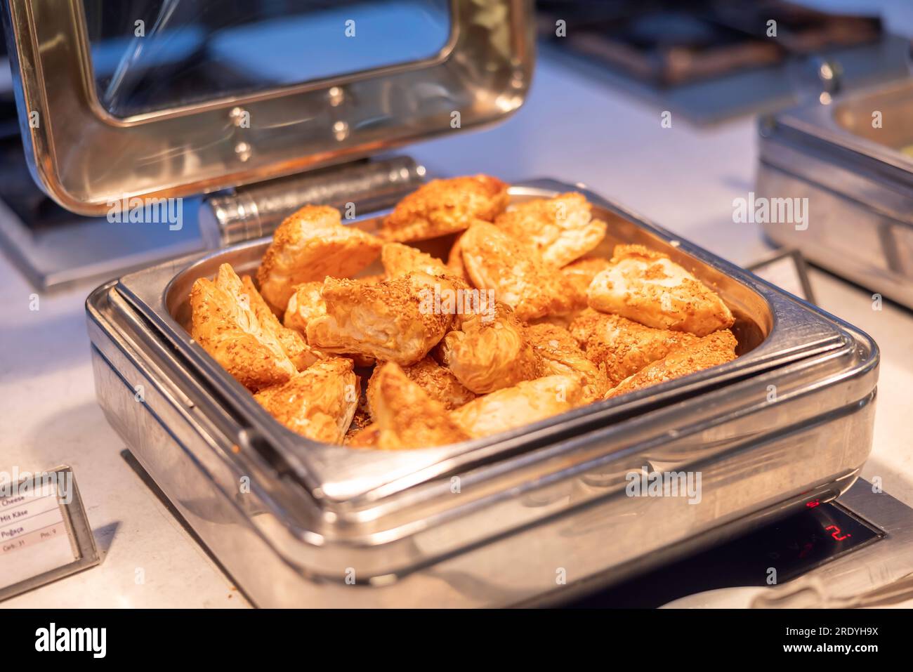 Puff pastry in Chafing Dish on buffet table in restaurant Stock Photo ...
