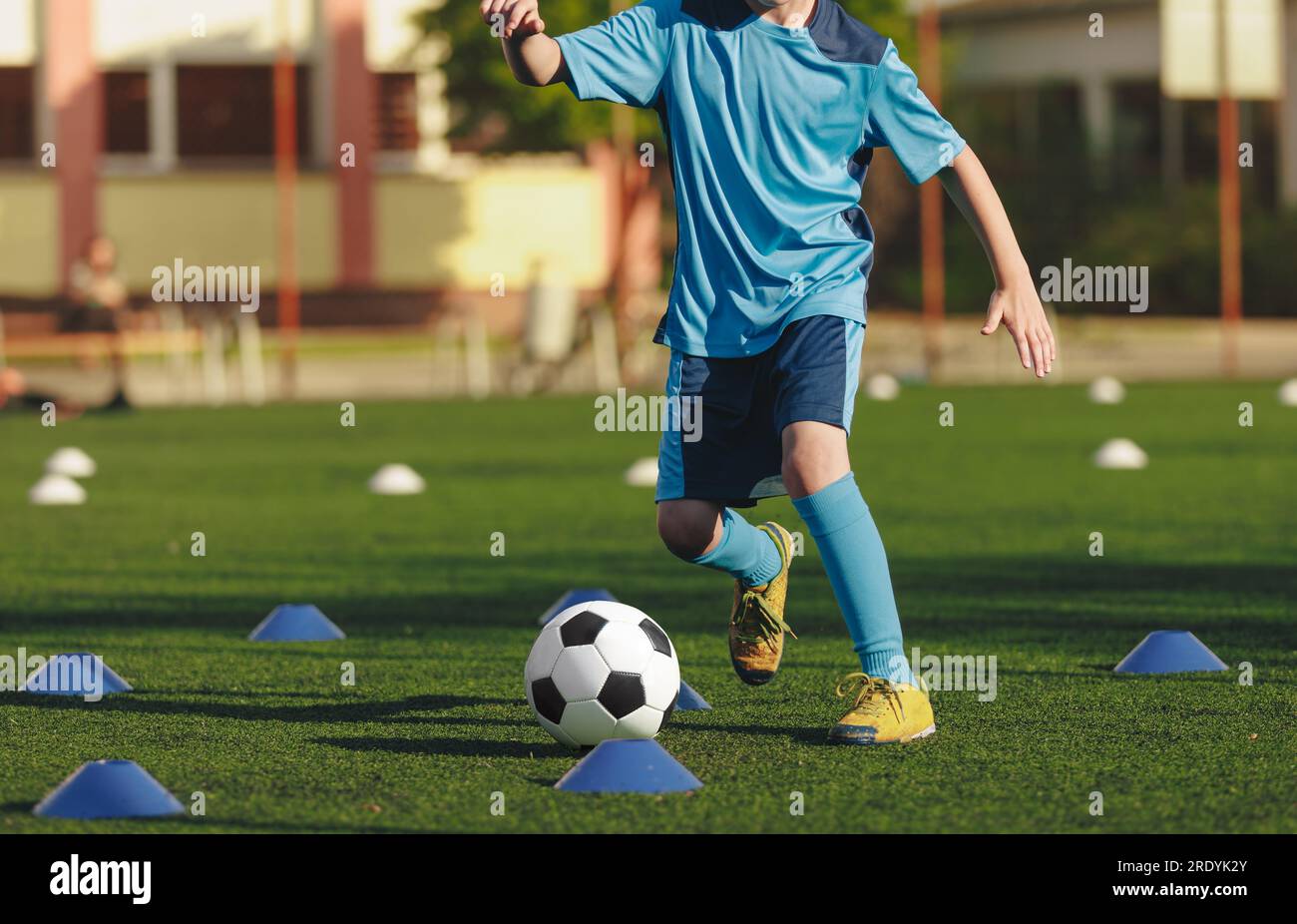 Physical education training class for children. Kids kicking classic ...