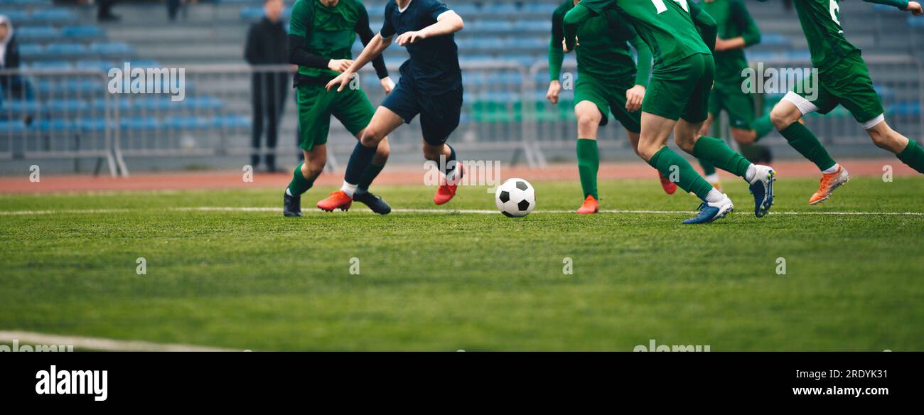 Soccer players run a game and kick soccer ball. European football ...