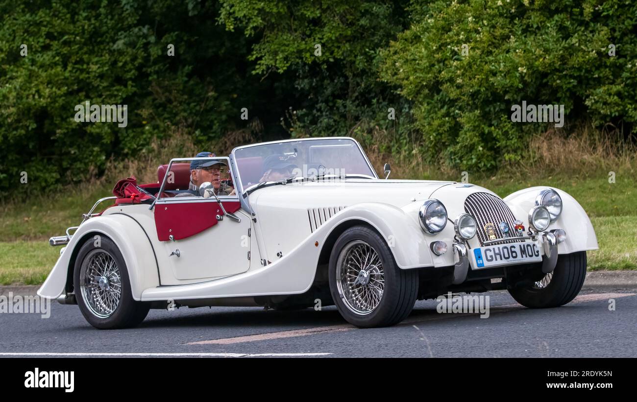 Milton Keynes,UK - July 21st 2023: 2012 white Morgan Roadster car driving on an English road ...