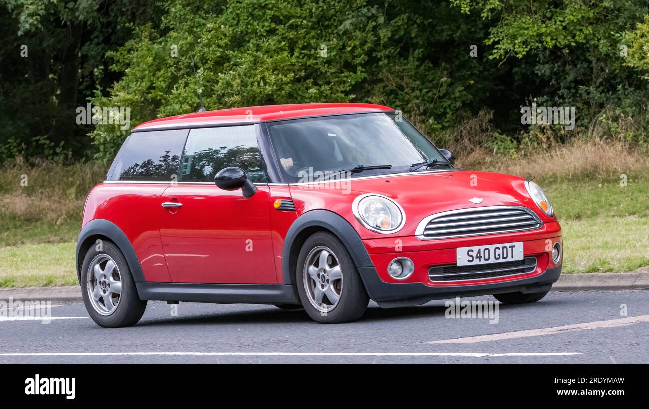 Milton Keynes,UK - July 21st 2023: 2008 red Mini car driving on an ...
