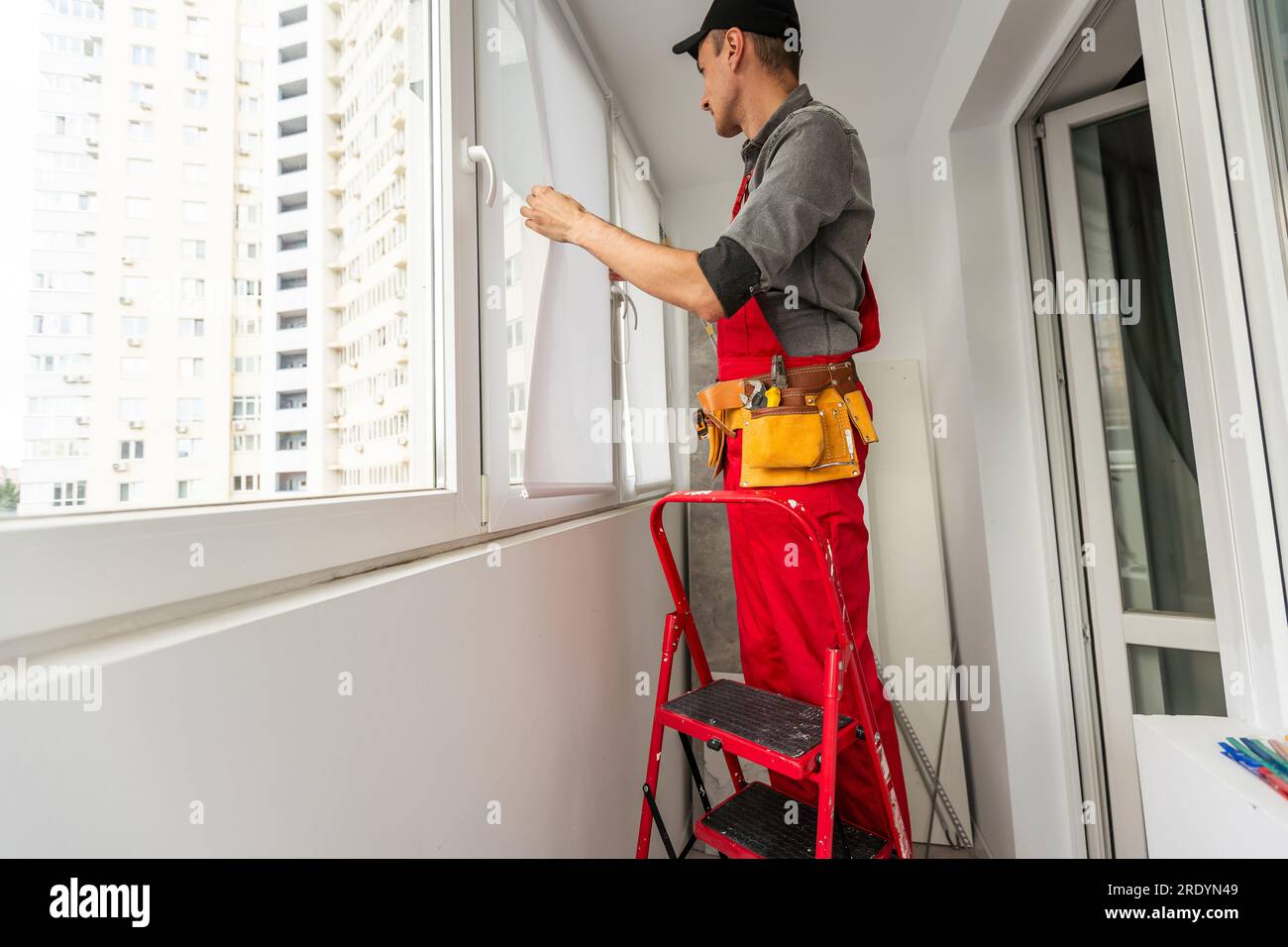 The worker installing and checking window in the house Stock Photo - Alamy