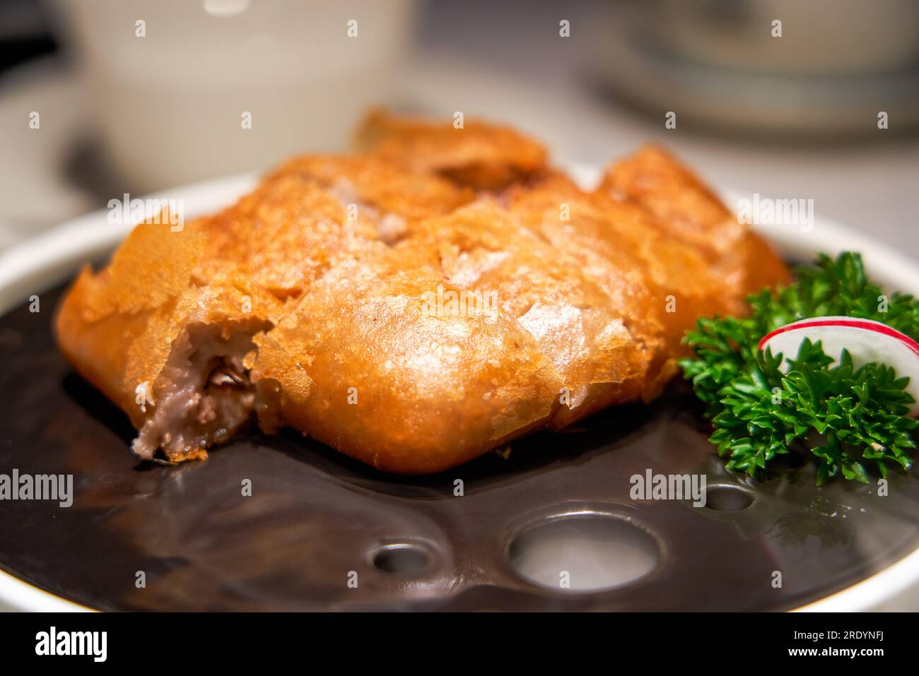 A delicious Chinese Hokkien dish, crispy taro duck Stock Photo - Alamy
