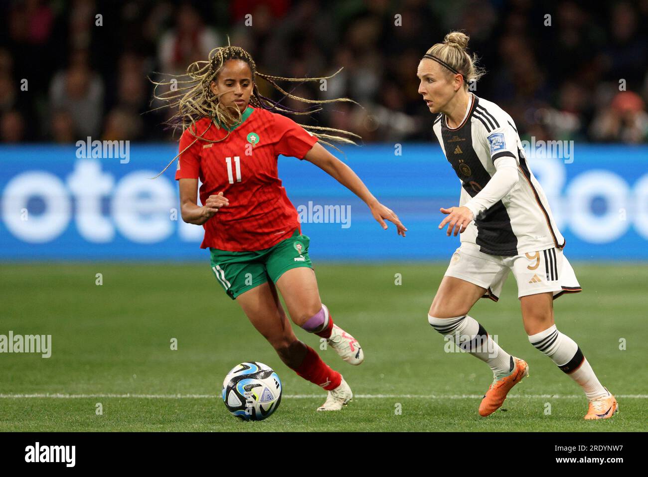 Morocco's Fatima Tagnaout, left, vies for the ball with Germany's ...