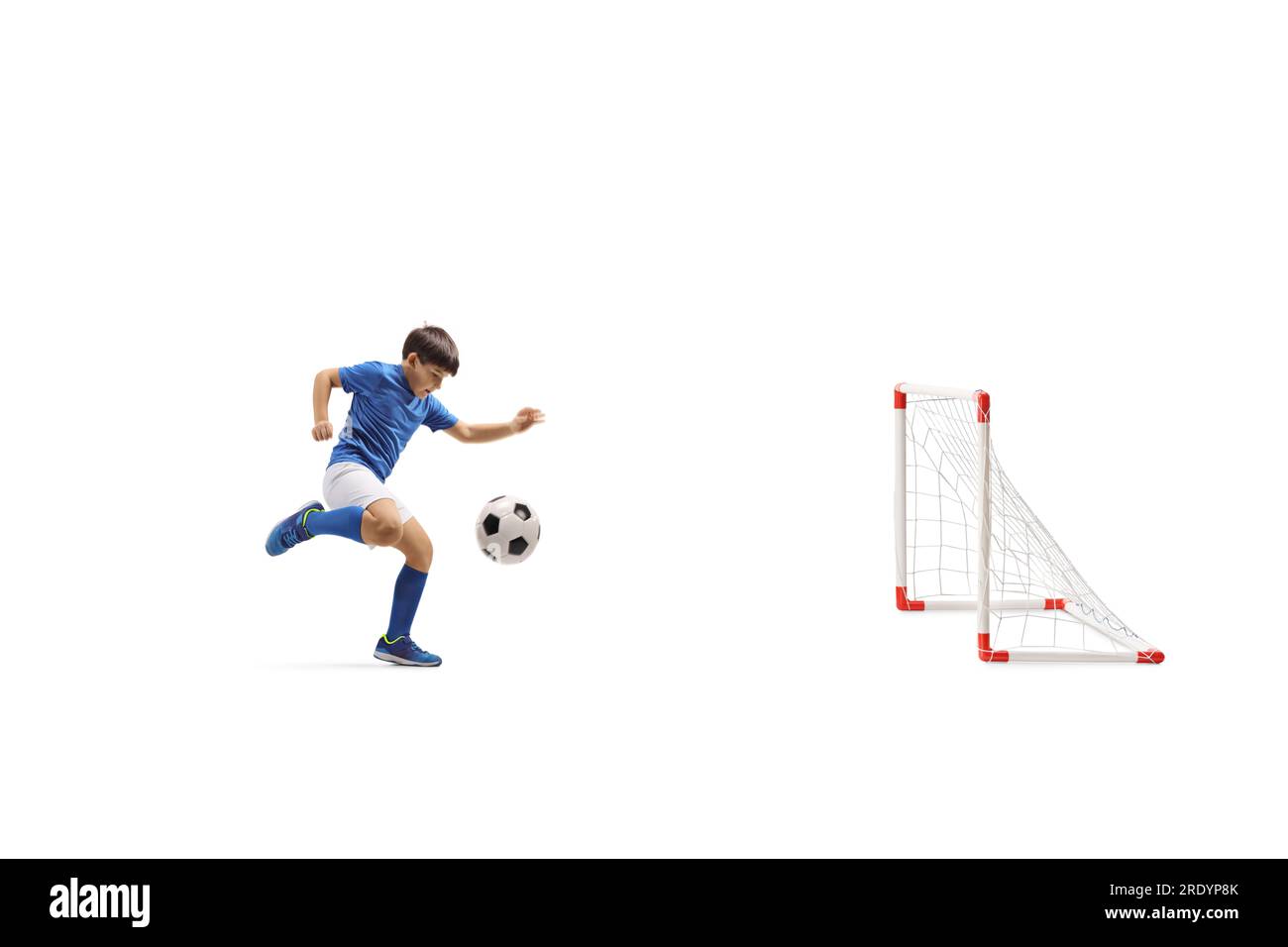 Full length shot of a boy scoring a goal isolated on white background ...