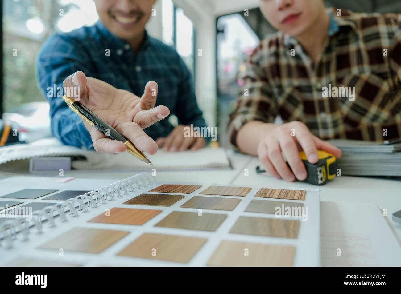 Engineers, designers and interior designers are finalizing the design of interiors by discussing ...