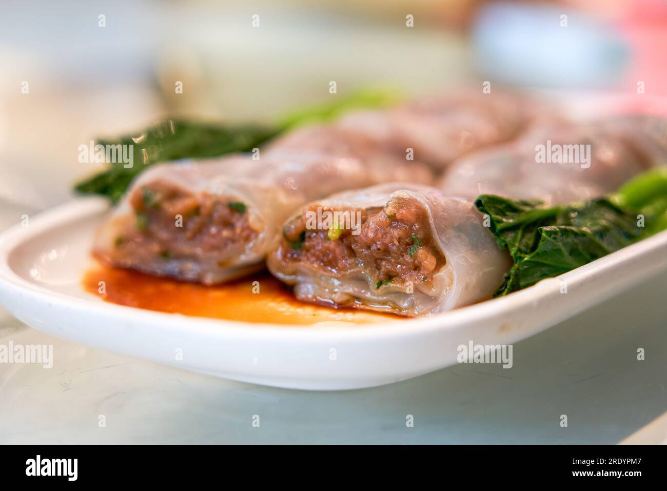 A plate of delicious Cantonese morning tea dim sum, beef rice rolls ...