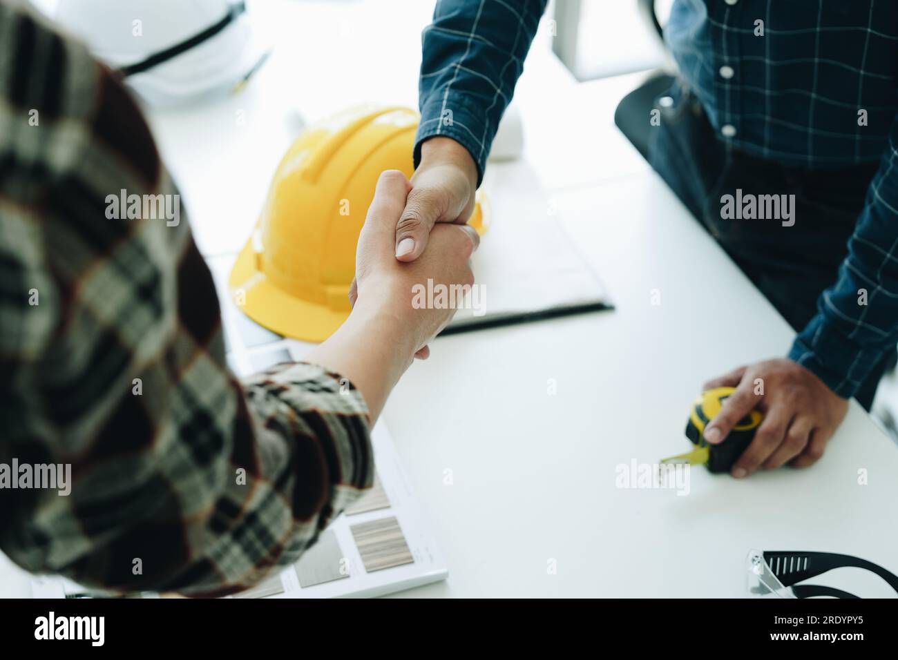 Engineers, designers and interior designers are handshake shack hands ...