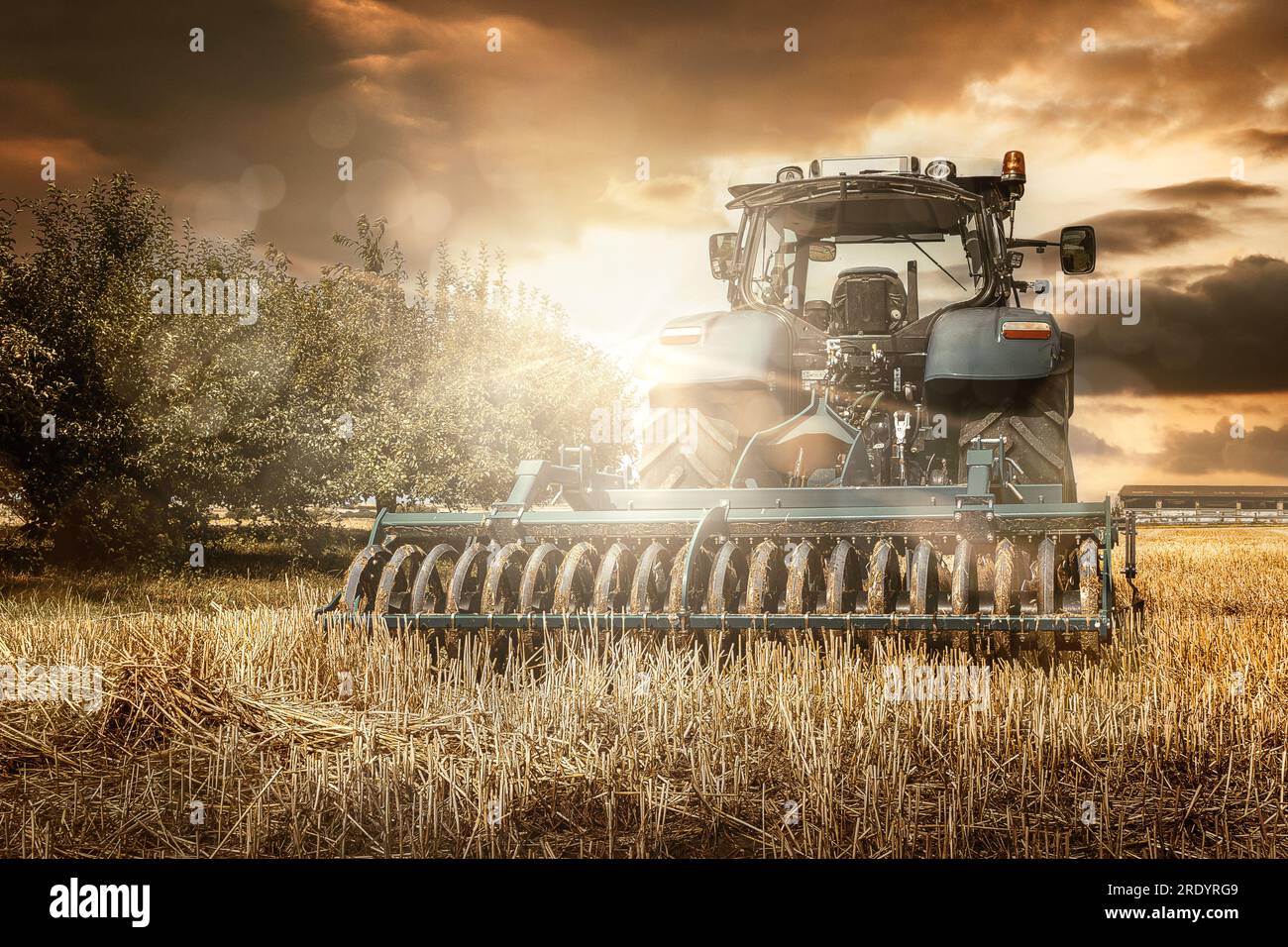 farmer with a soil plow in preparation for planting is ready for action ...