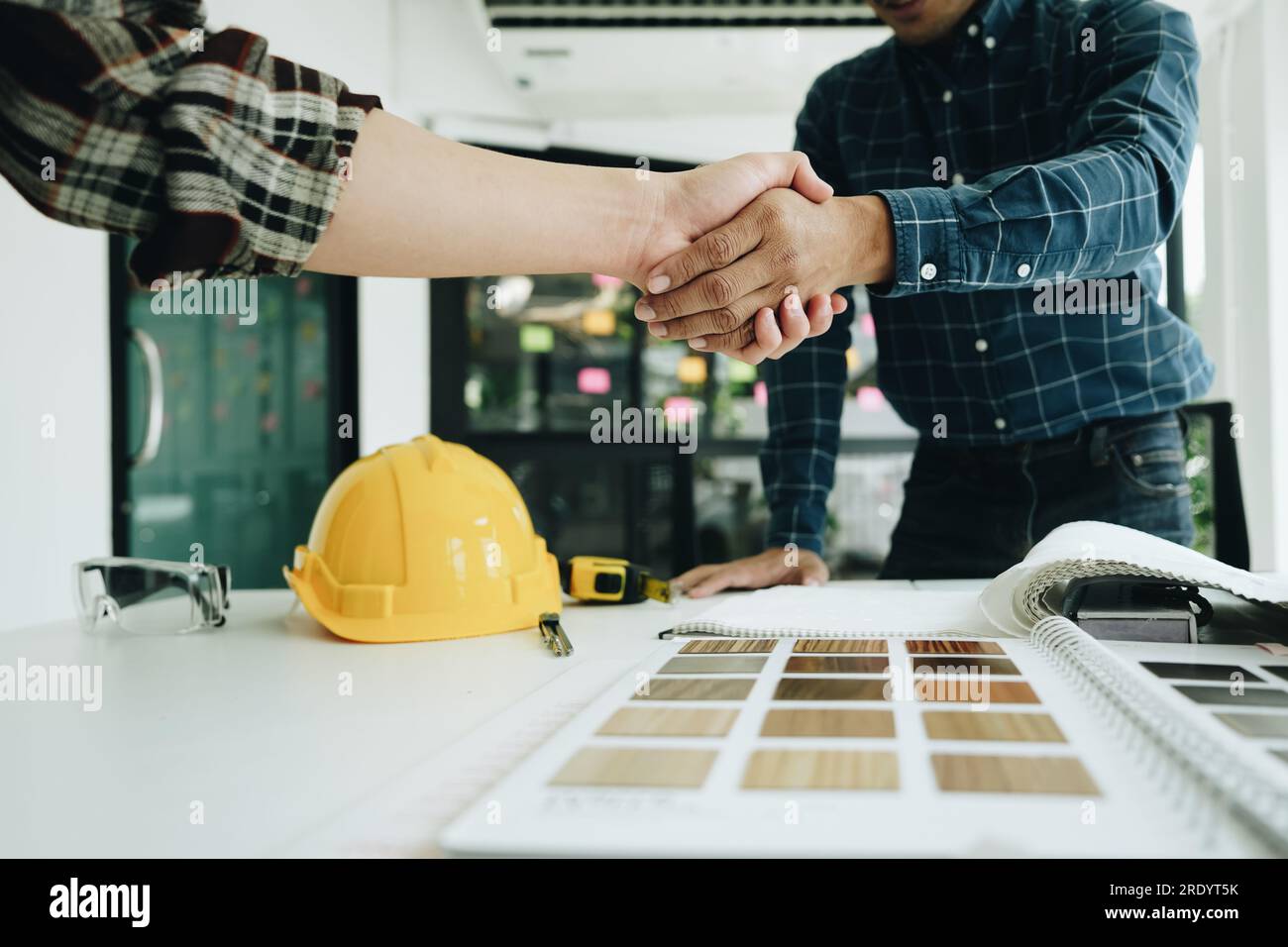 Engineers, designers and interior designers are handshake shack hands ...