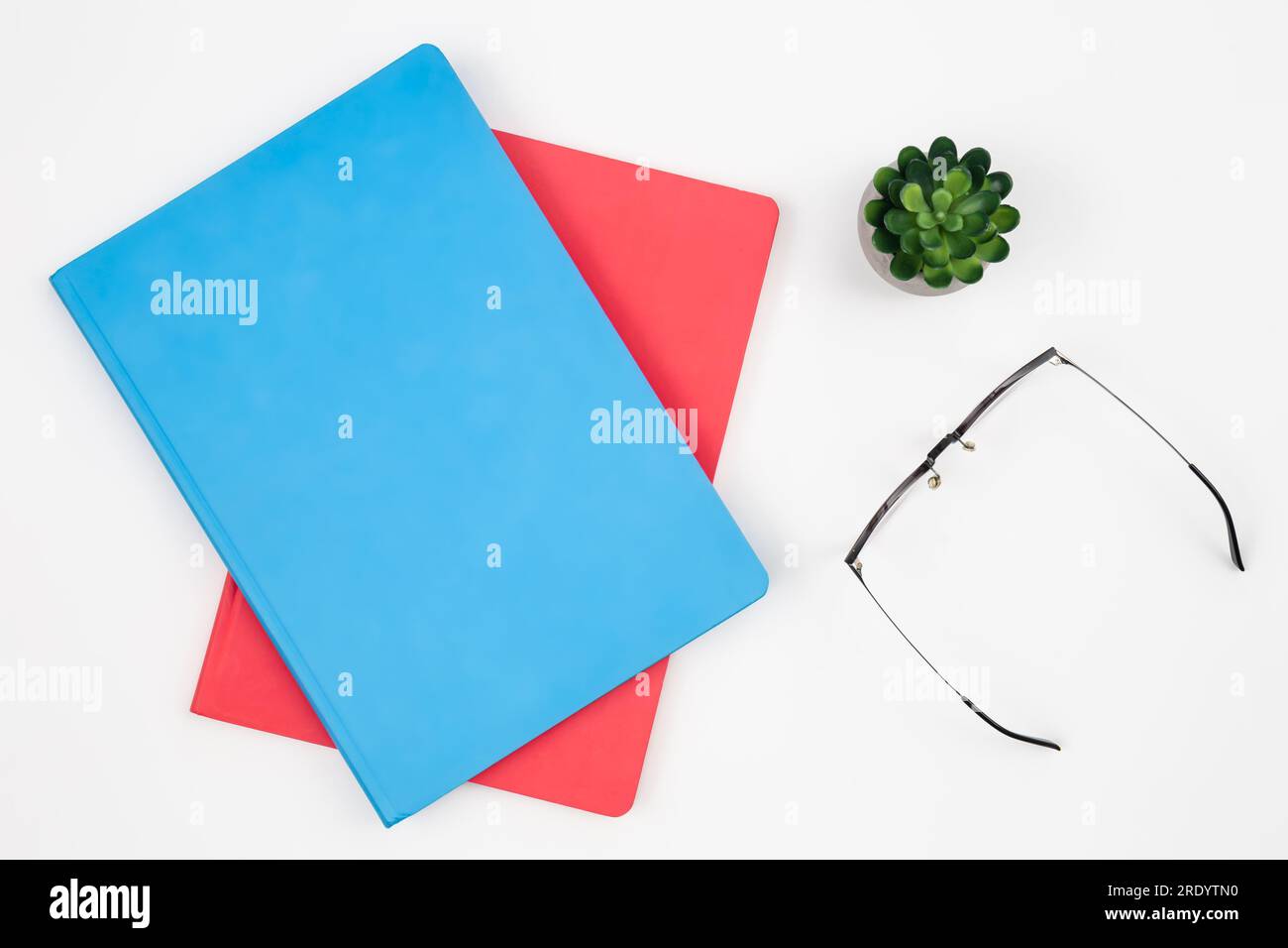 Colored notepads and glasses on a white background isolated Stock Photo ...