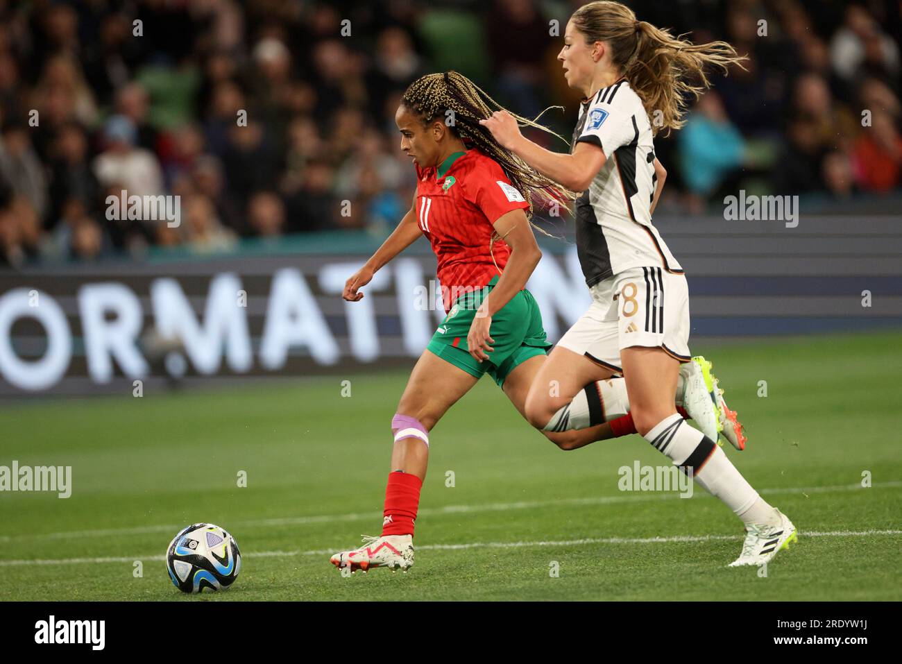 Morocco's Fatima Tagnaout drives the ball past Germany's Melanie ...