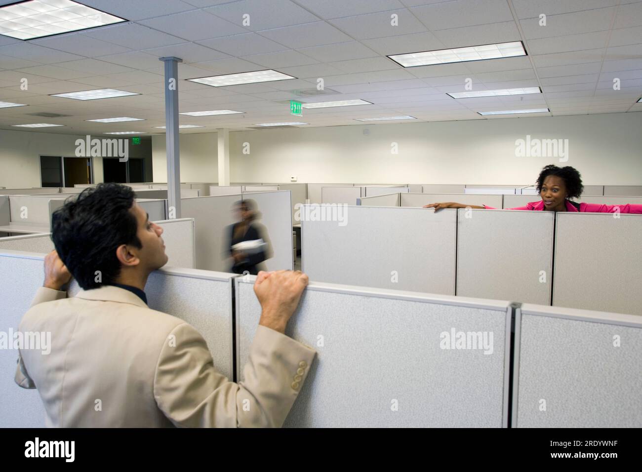 office workers talk over cubicle walls Stock Photo - Alamy