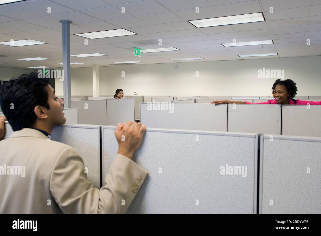 office workers talk over cubicle walls Stock Photo - Alamy