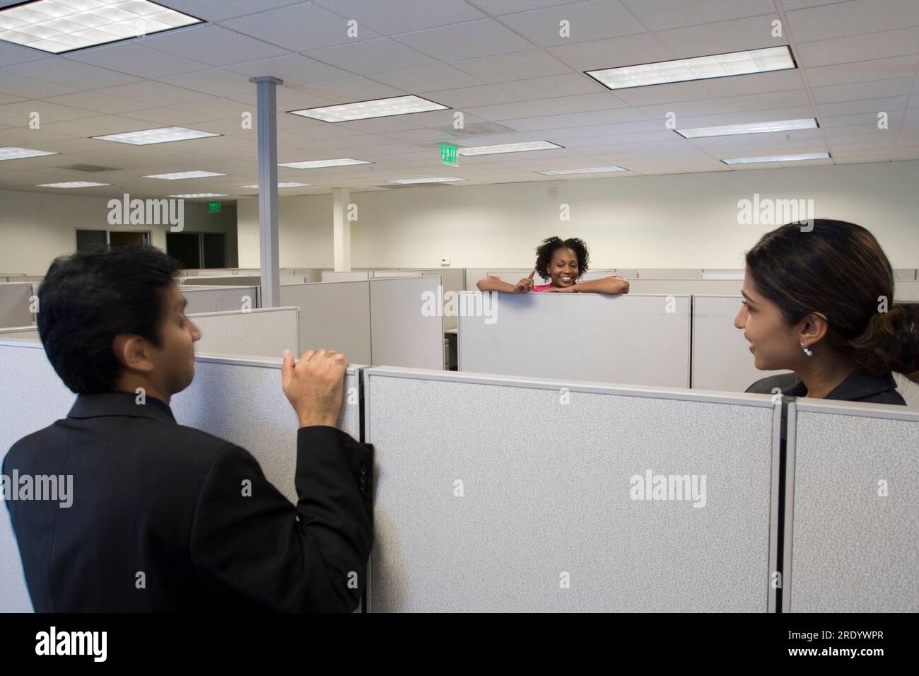 office workers talk over cubicle walls Stock Photo - Alamy