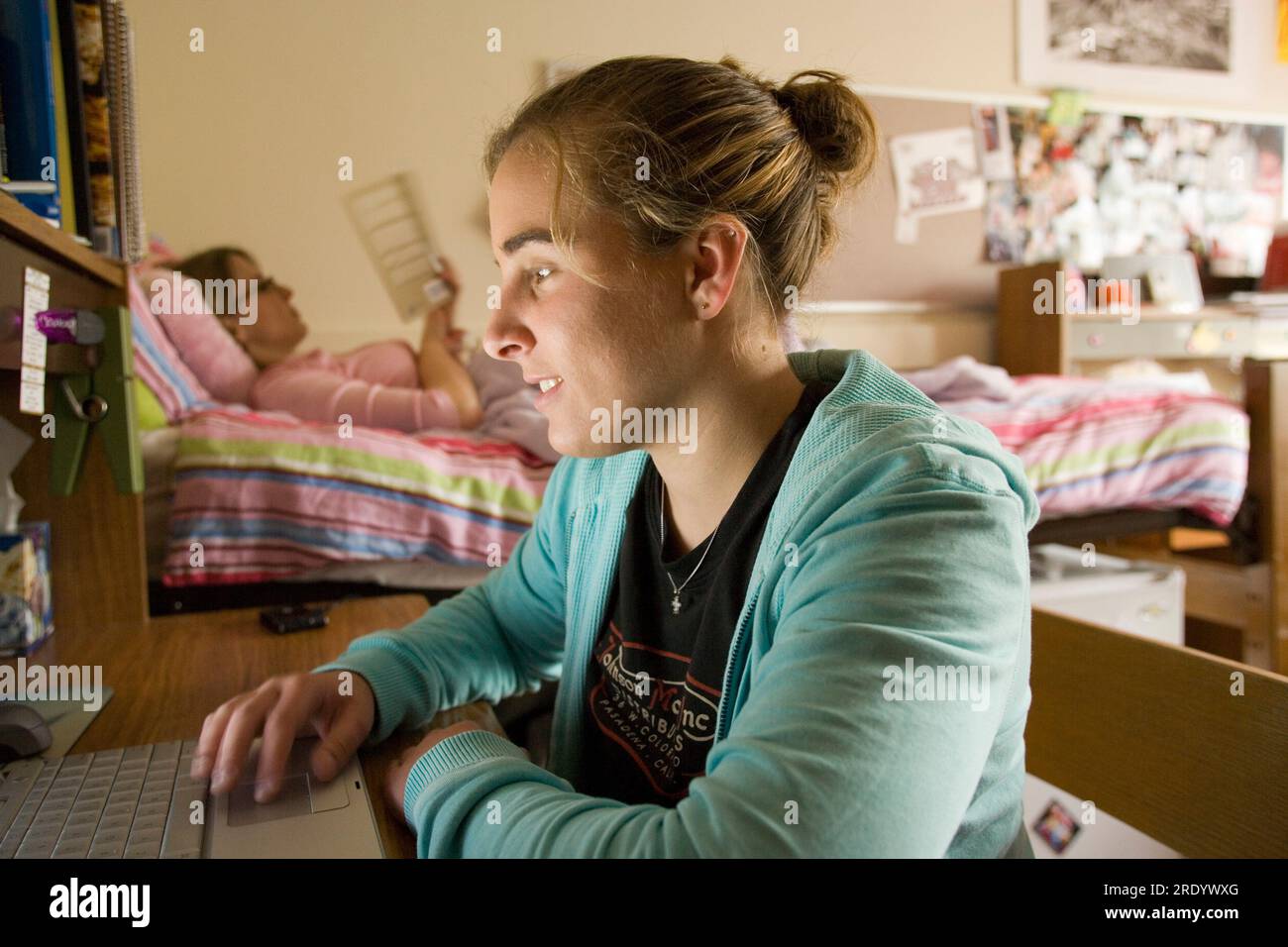 Two 18 year-old female roomates study in their college dormatory Stock ...