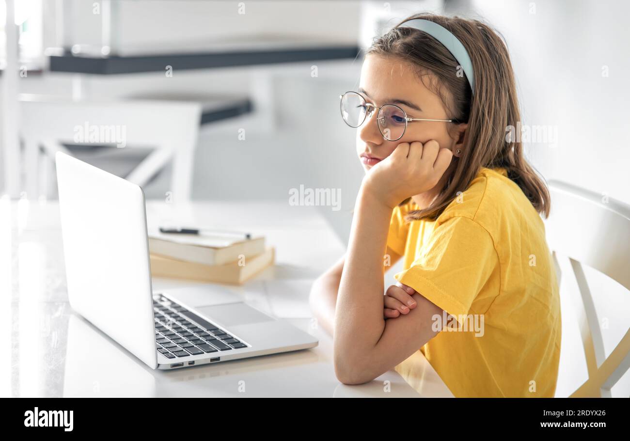 Exhausted schooler girl suffering from doing homework, tired from ...