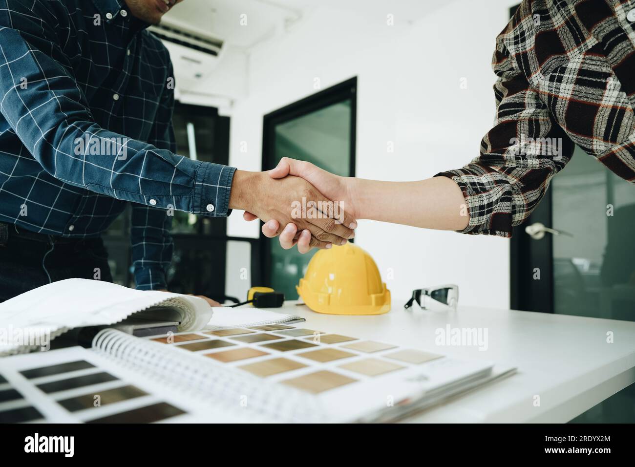 Engineers, designers and interior designers are handshake shack hands ...