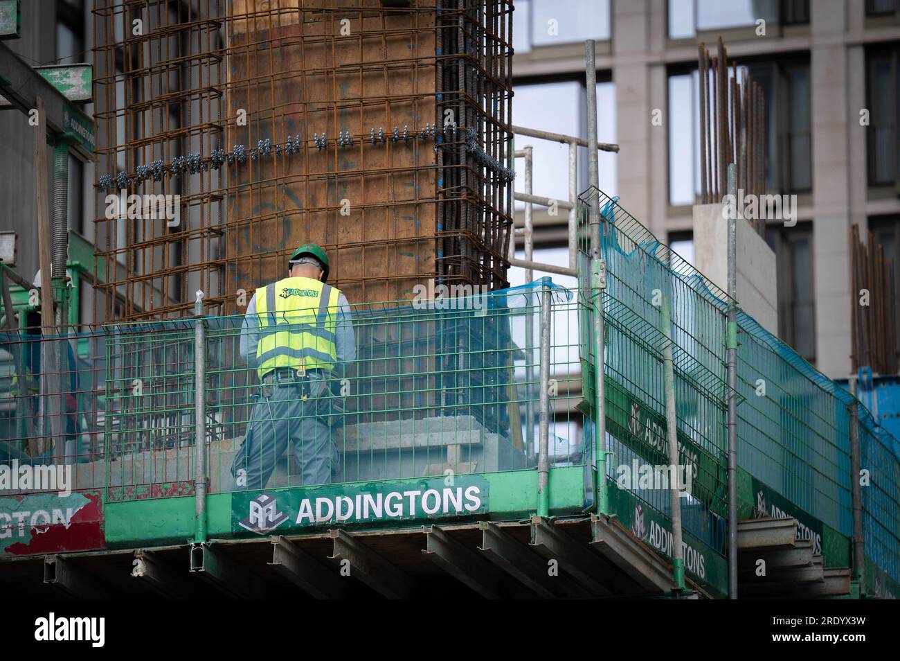 Construction workers on a building site near South Bank, London, as ...