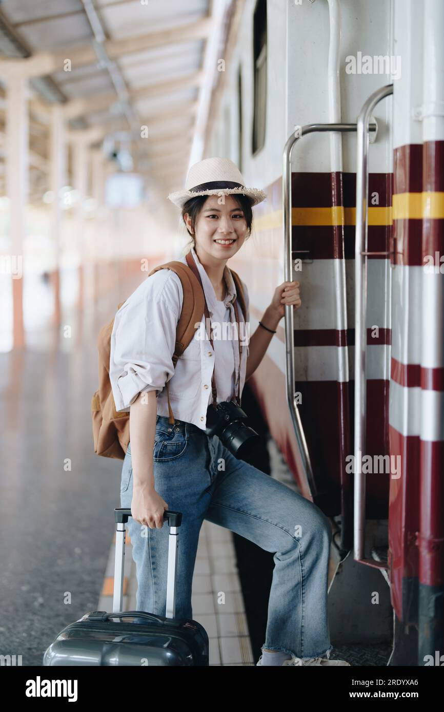 Tourists are showing happy expressions while waiting for their journey ...