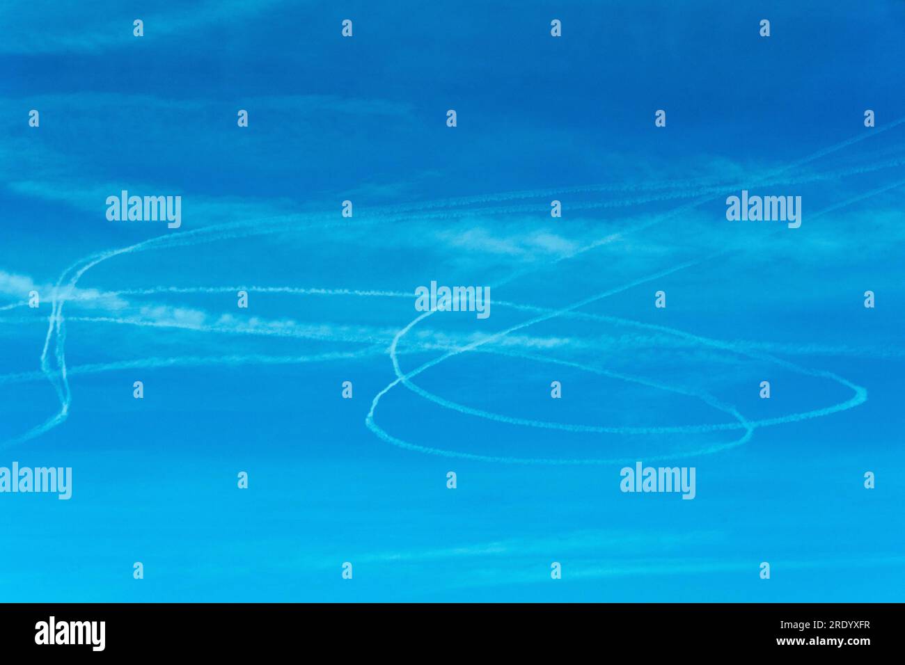 Vapor trail of the airplane in a blue sky Stock Photo - Alamy