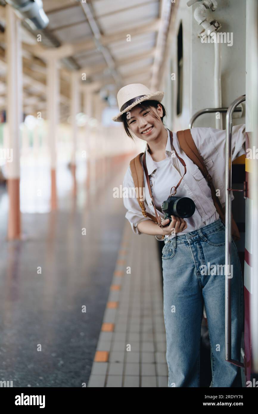 Tourists are showing happy expressions while waiting for their journey ...